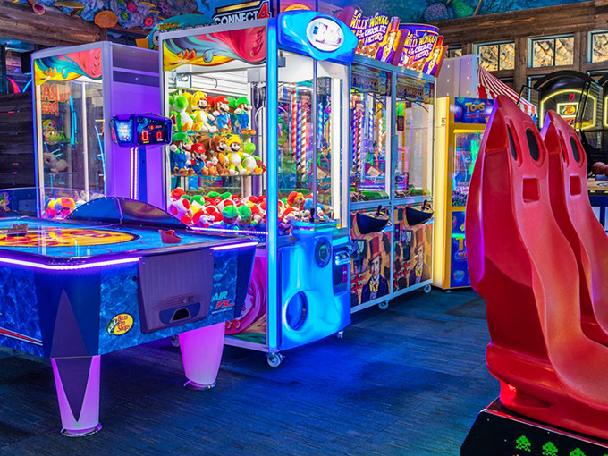 The arcade area glows with neon promise, offering electronic treasures and games that will empty pockets faster than a school of piranha.