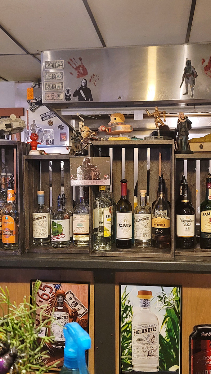 The bar area showcases both spirits and collectibles – a perfect pairing for this themed establishment.