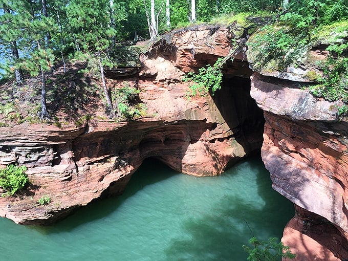 A natural bridge formed over thousands of years of persistent wave action &ndash; Lake Superior's patient artistry on magnificent display.