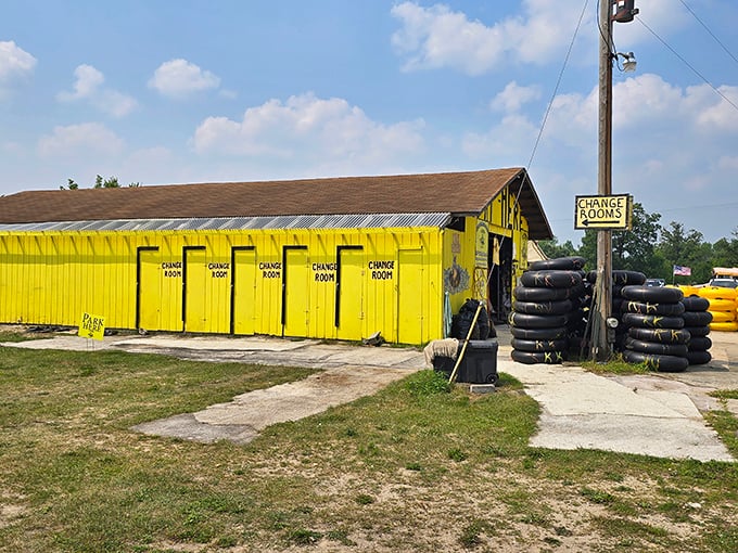 The cheerful yellow change rooms stand ready for the before-and-after transformation of river adventurers.