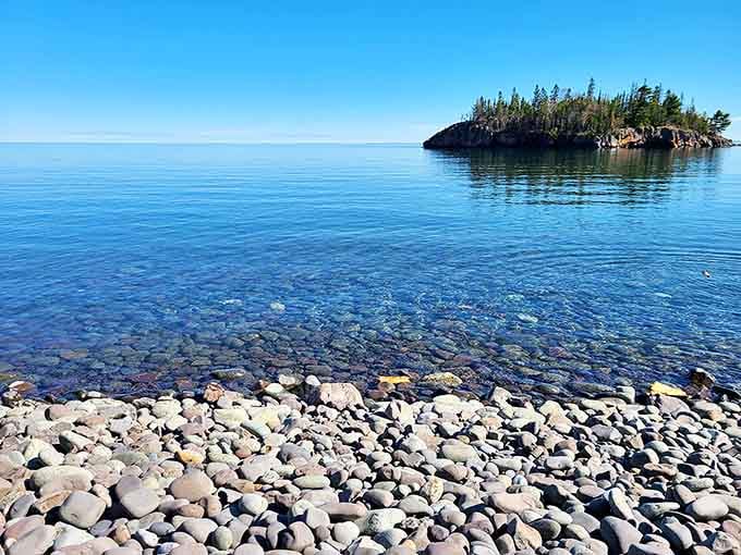 The water clarity here would make Caribbean resorts jealous—you can count pebbles through feet of pristine Lake Superior.
