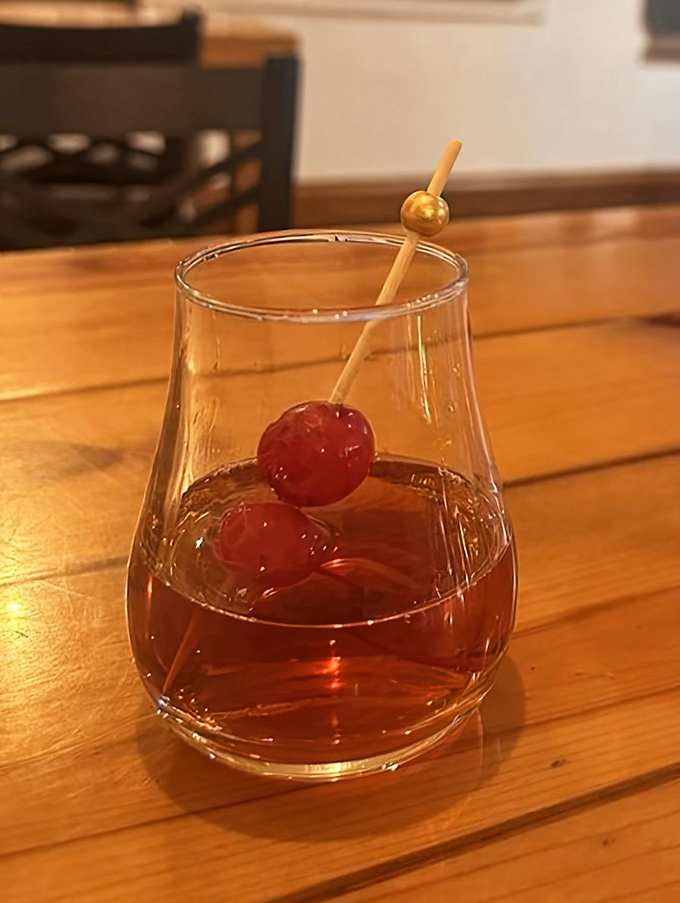 An Old Fashioned garnished with cherries, Wisconsin's signature cocktail served with no unnecessary frills.