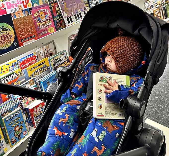 A young reader discovers the magic early, cozily nestled in a stroller with a book already in hand &ndash; the start of a lifelong love affair with reading.