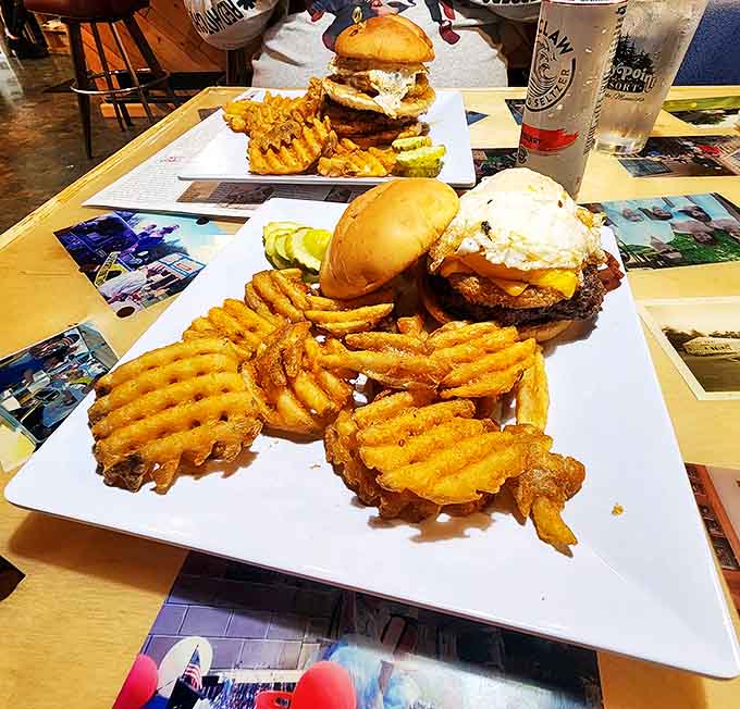 That's not just a burger &ndash; it's a towering masterpiece of beef, cheese, and toppings that requires both hands and several napkins!
