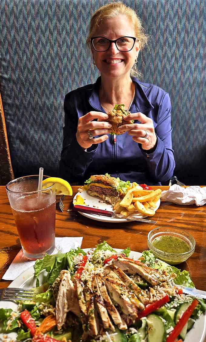 A patron enjoys her meal with the kind of genuine delight that no marketing campaign can manufacture &ndash; this is what real food happiness looks like.