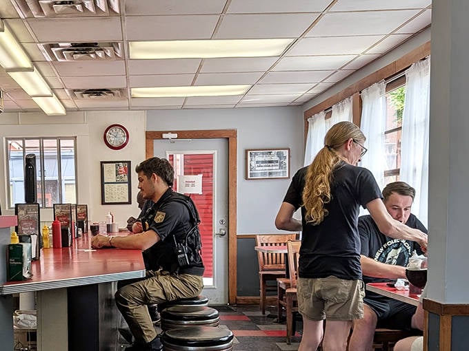 Families gather at the counter, where generations bond over shared meals and the timeless ritual of diner breakfast.
