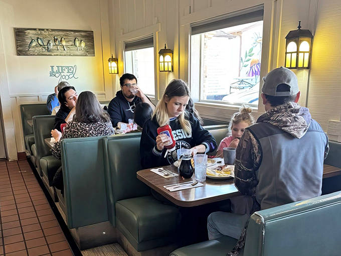 Families gather in turquoise booths, creating memories over maple syrup and bacon &ndash; the true Minnesota social network.