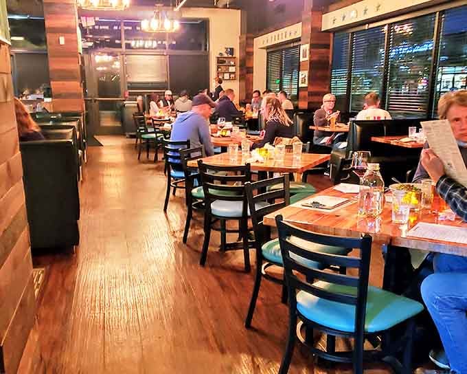 A bustling dining room filled with happy conversations &ndash; the true measure of a restaurant's success beyond its innovative service approach.