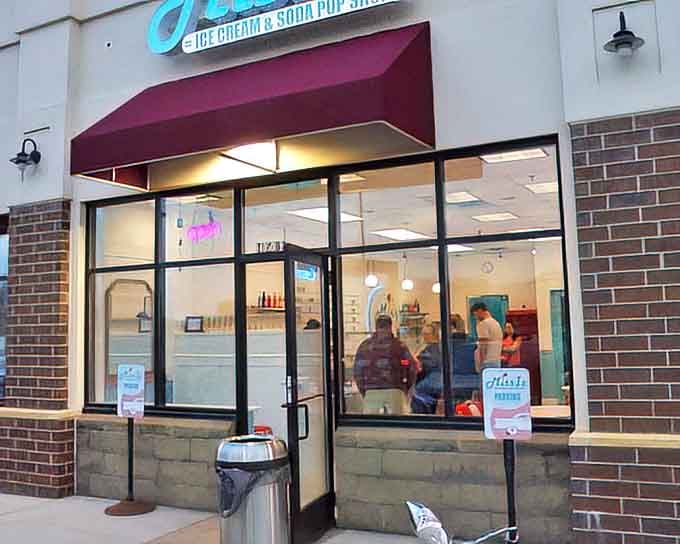 Evening glow transforms Miss Iz into a beacon of sweetness, drawing dessert pilgrims from across Minnesota to its hallowed doors.