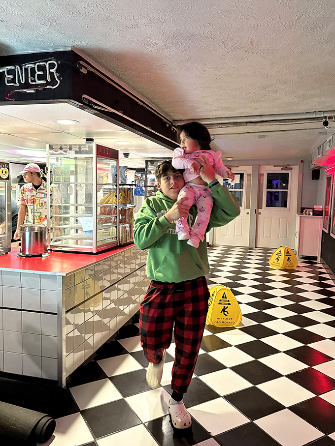 The black-and-white checkered concession area serves up nostalgia alongside buttery popcorn and classic movie treats.