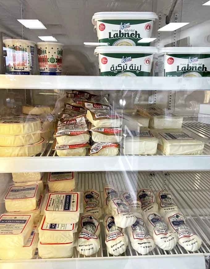 The refrigerated section houses labneh, halloumi, and other dairy delights that make ordinary cheese seem like a distant cousin.
