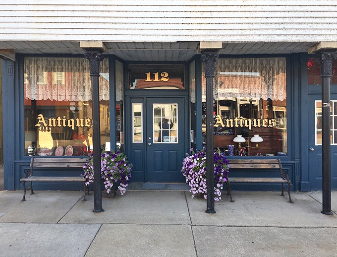 The storefront's classic blue exterior and welcoming flower boxes offer the first hint that something special awaits inside these historic walls.