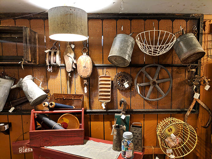 This wall of galvanized treasures and farm implements creates an industrial tapestry, each piece having earned its rust spots through years of honest work.