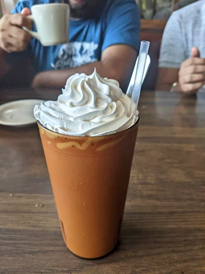 An iced coffee topped with a cloud of whipped cream &ndash; the perfect companion for pie contemplation or people-watching from your booth.