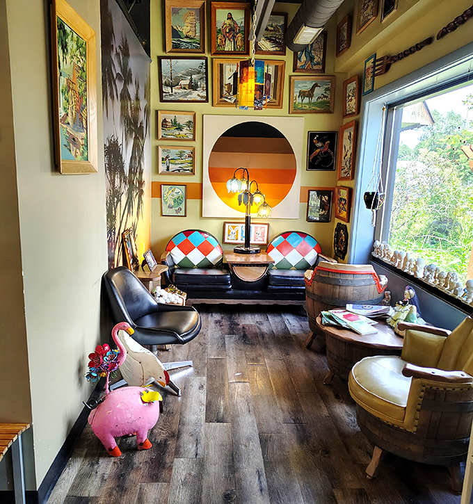 The lounge area features mismatched vintage furniture, whimsical animal sculptures, and enough art to keep waiting guests thoroughly entertained.