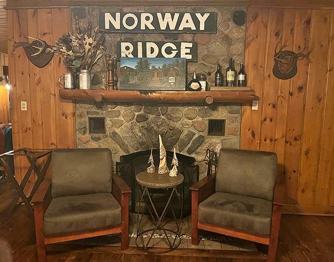 The lounge area invites post-dinner relaxation &ndash; where the "Norway Ridge" sign above the stone fireplace reminds you exactly where you belong.