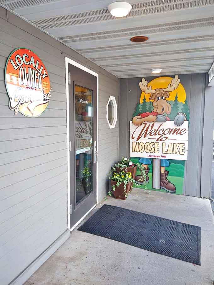 A cheerful moose welcomes visitors at the entrance, setting the tone for the authentic local experience waiting inside.