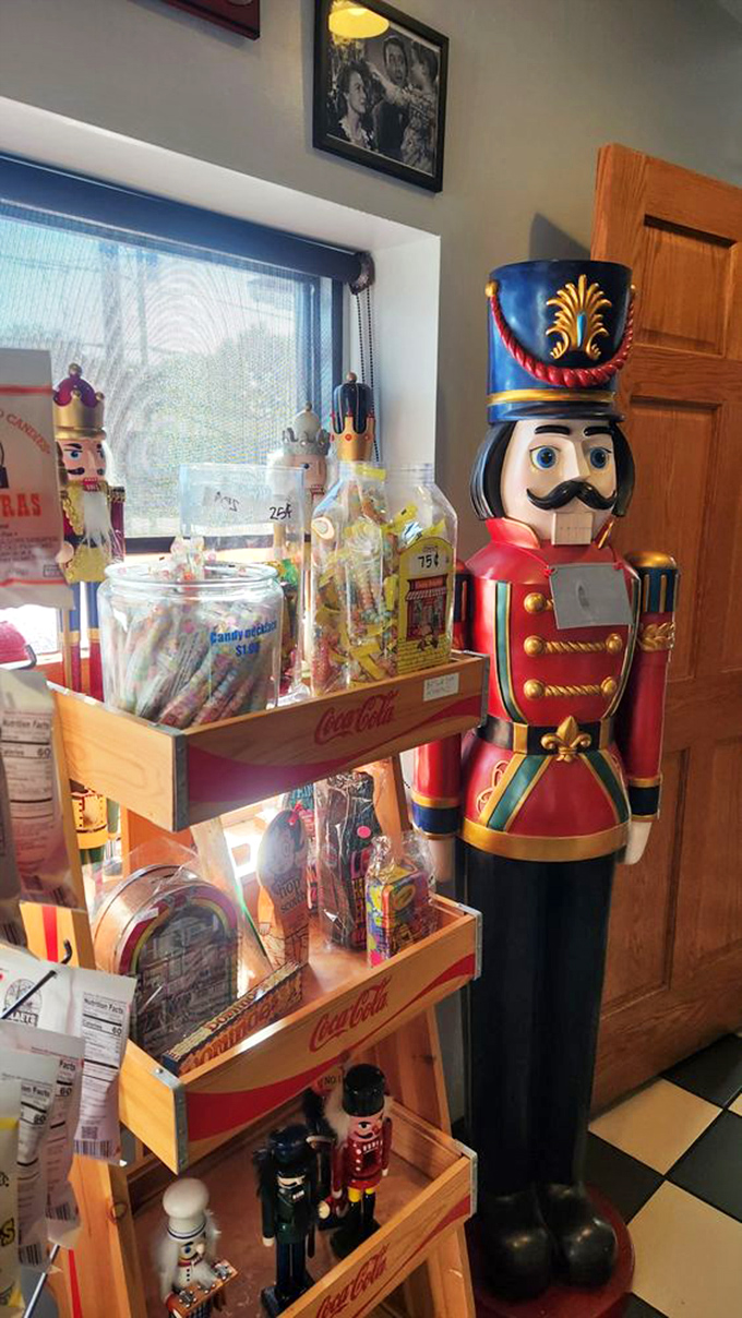 Nutcracker soldiers stand guard throughout the restaurant, whimsical wooden sentinels watching over diners while vintage candy fills Coca-Cola crates nearby.