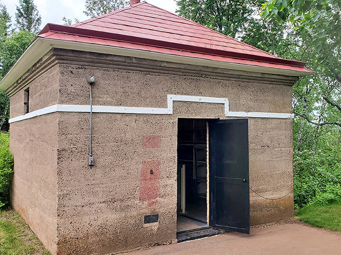 The oil house stored fuel for the light, proving even lighthouse romance required practical considerations like proper storage.