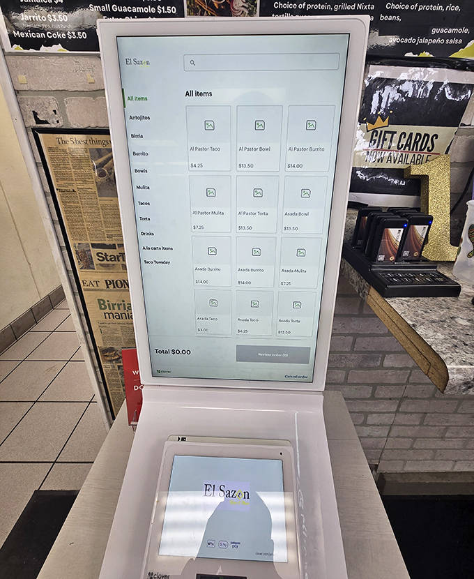 Modern meets traditional as this touchscreen kiosk guides hungry patrons through a customizable taco adventure with digital precision.