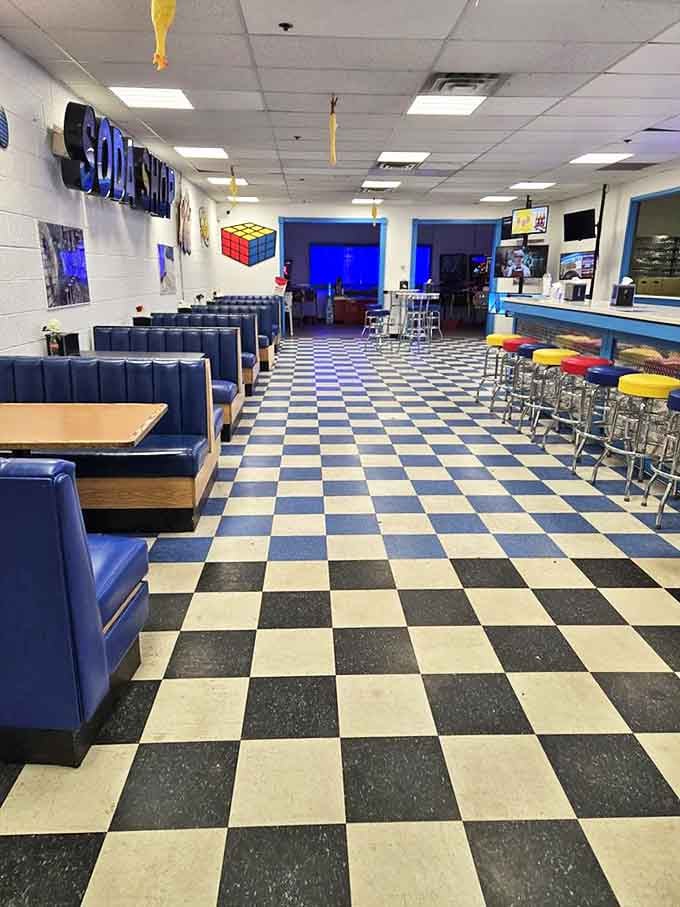 Blue booths and colorful stools create a retro diner atmosphere that perfectly complements the sweet offerings.