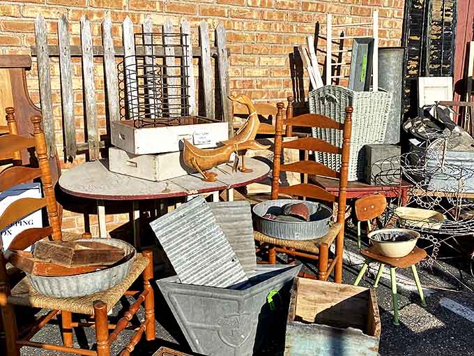 Outdoor treasures await discovery, from weathered furniture to architectural salvage, creating a rustic wonderland for garden enthusiasts and decorators alike.