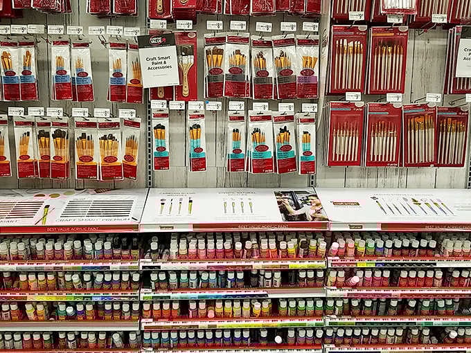 Paintbrushes stand at attention like tiny soldiers, each one a different specialist waiting to be deployed on your artistic battlefield.