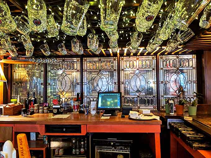 Behind the bar, crystal steins hang like chandeliers above stained glass panels&mdash;a shrine to German brewing tradition in the heart of Minneapolis.