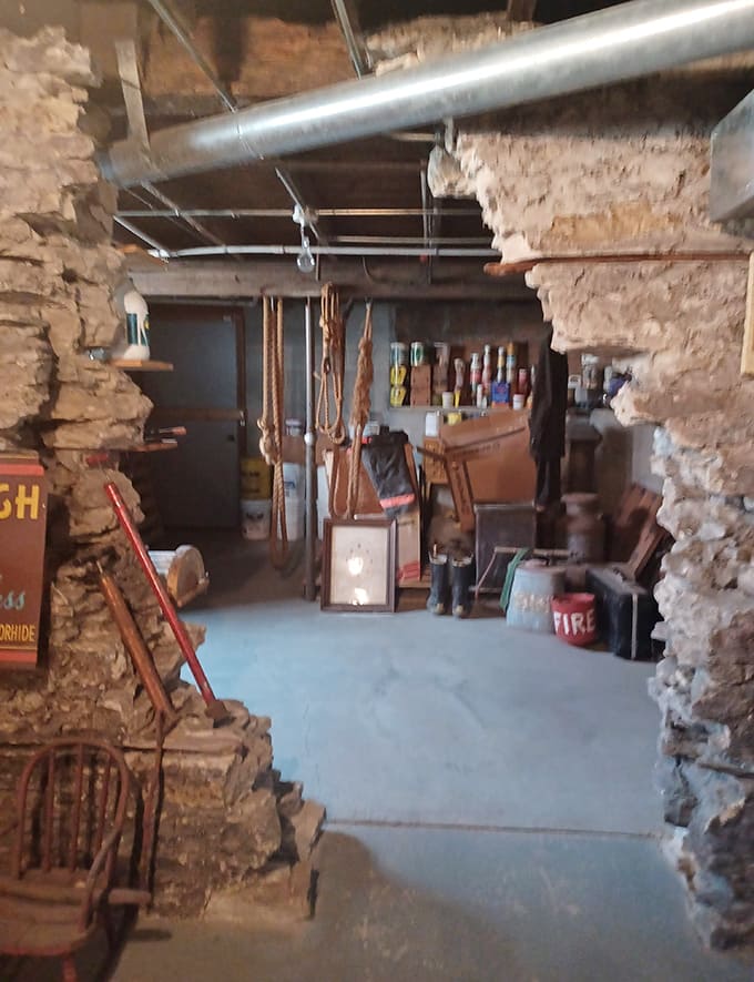 The stone basement feels like America's foundation – rough-hewn walls housing tools and treasures awaiting rediscovery by curious visitors.