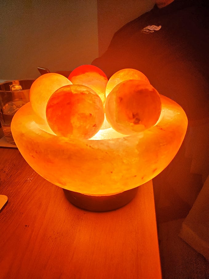 Himalayan salt lamps cast their warm glow throughout the space. They're like night lights for adults with excellent taste.