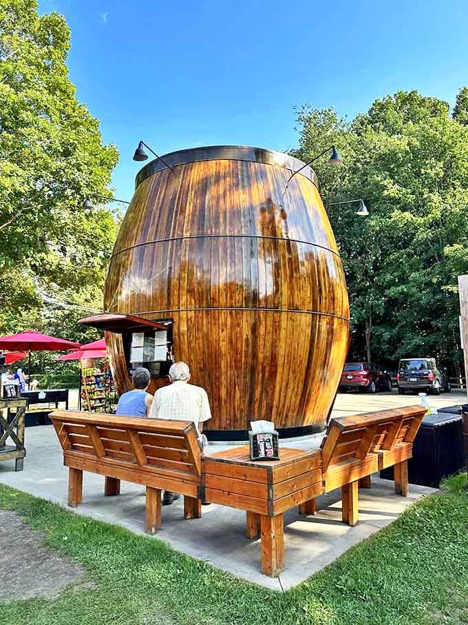 Wooden benches encircle the barrel, offering the perfect vantage point to enjoy your treats while admiring this architectural oddity.