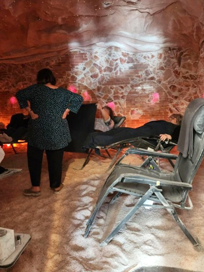 Visitors settle into their recliners as the salt-infused air begins its gentle work, creating a shared silence that somehow feels communal.