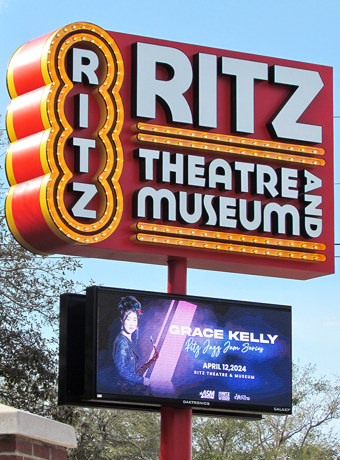 The Ritz's unmistakable signage stands proud against Florida skies, announcing cultural experiences that transcend ordinary entertainment.