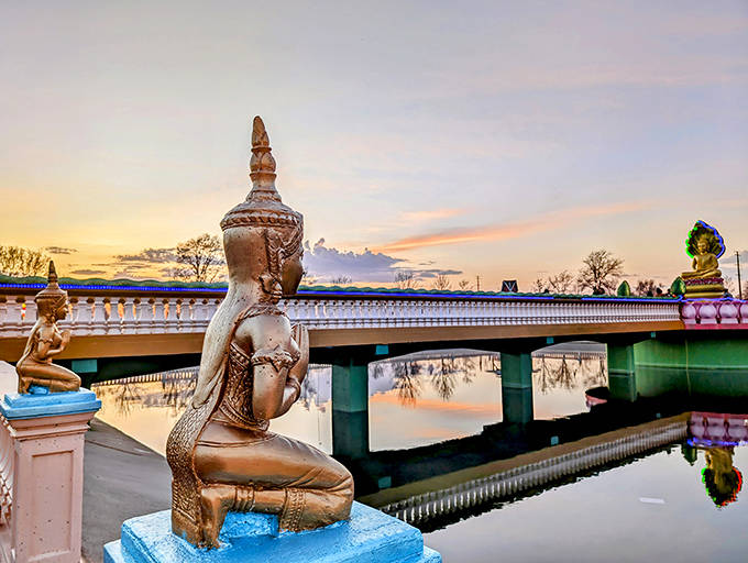 As day fades to dusk, the temple grounds take on a magical quality, with statues silhouetted against Minnesota's expansive sky.