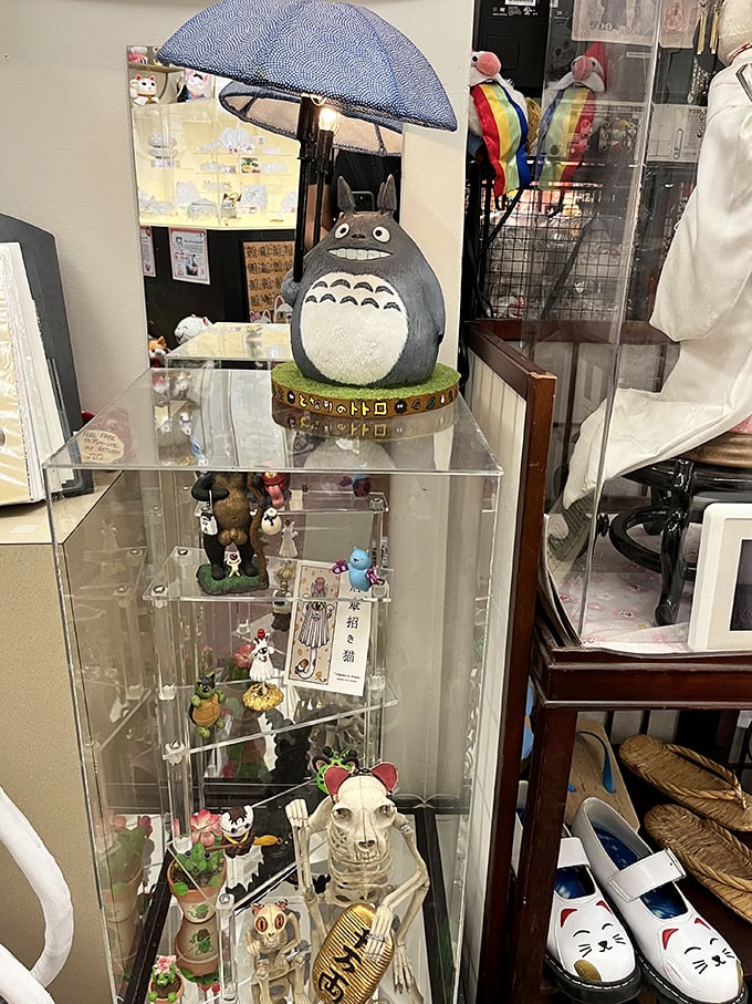 Studio Ghibli's beloved Totoro joins the collection, umbrella in hand, bridging traditional lucky symbols with contemporary Japanese animation icons.
