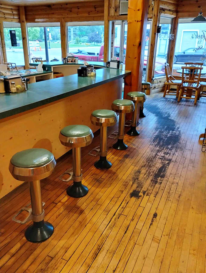 The counter offers front-row seats to the morning ballet of coffee pouring and order-taking, perfect for solo diners.