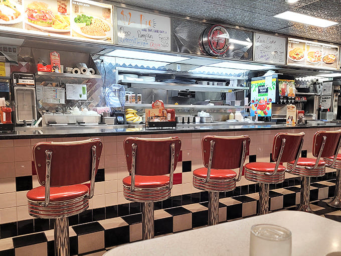 The open kitchen concept isn't trendy here &ndash; it's tradition, allowing diners to watch their meals come to life on that seasoned grill.