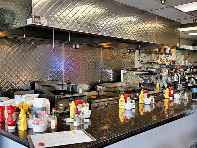 The open kitchen reveals the choreographed precision of spatulas and sizzling grills &ndash; a ballet of breakfast preparation in motion.