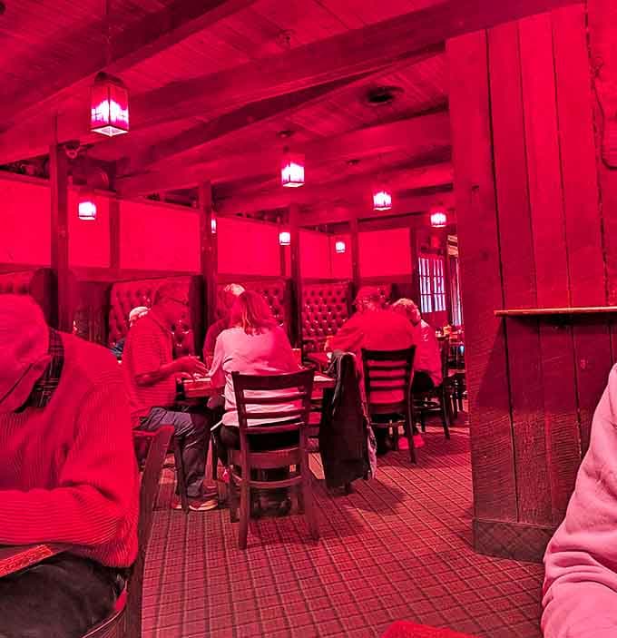 The dining room glows with a warm red ambiance that makes everyone look good and every meal feel like a special occasion.