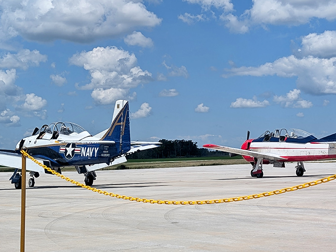 These beautifully maintained training aircraft sit proudly on the tarmac, their polished surfaces gleaming under Wisconsin's summer sky.
