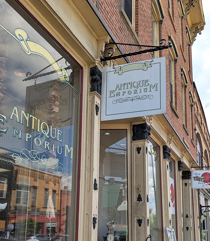 The Antique Emporium's elegant signage beckons collectors and the curious to hunt for treasures with stories to tell.