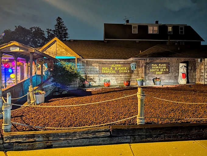 As night falls, Hala Kahiki glows like a beacon of tropical promise &ndash; its illuminated exterior hinting at the rum-soaked paradise waiting just beyond the threshold.