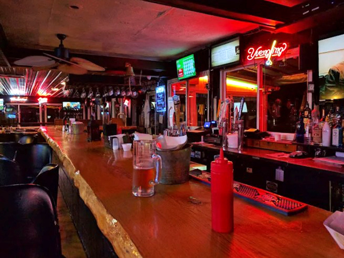 The bar's warm glow invites you to linger over one more craft beer while trading barbecue stories with newfound friends.