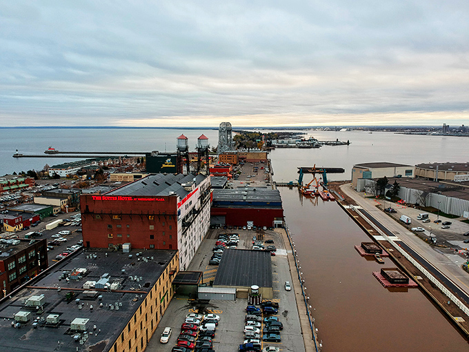 Industrial canal waters reflect the city's working heritage, where massive ships navigate channels with surprising delicacy.