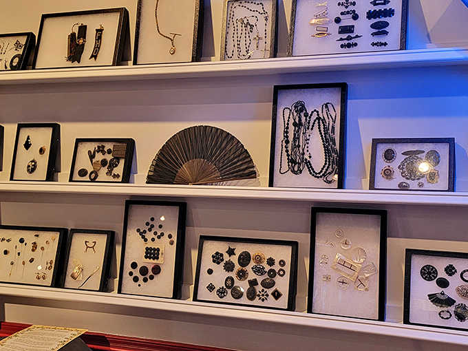 A collection of mourning jewelry and buttons displays the intricate ways Victorians carried memories of loved ones in wearable, everyday reminders.