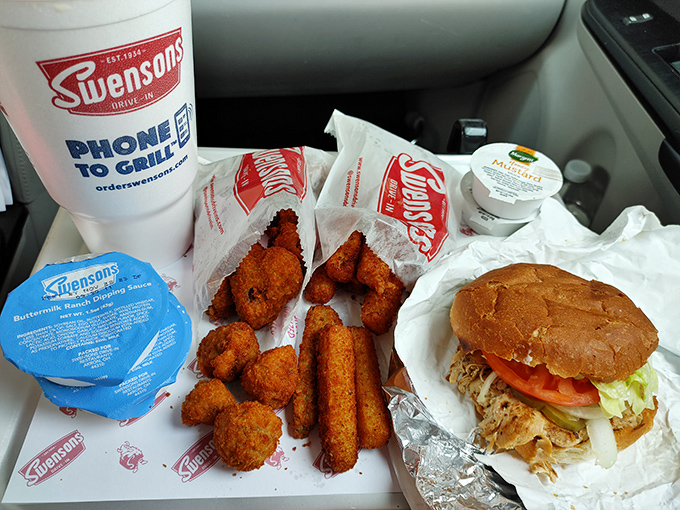Combo Meal: The ultimate car picnic &ndash; sandwich, sides, and shake arranged on your personal tray, turning your front seat into the best table in town.