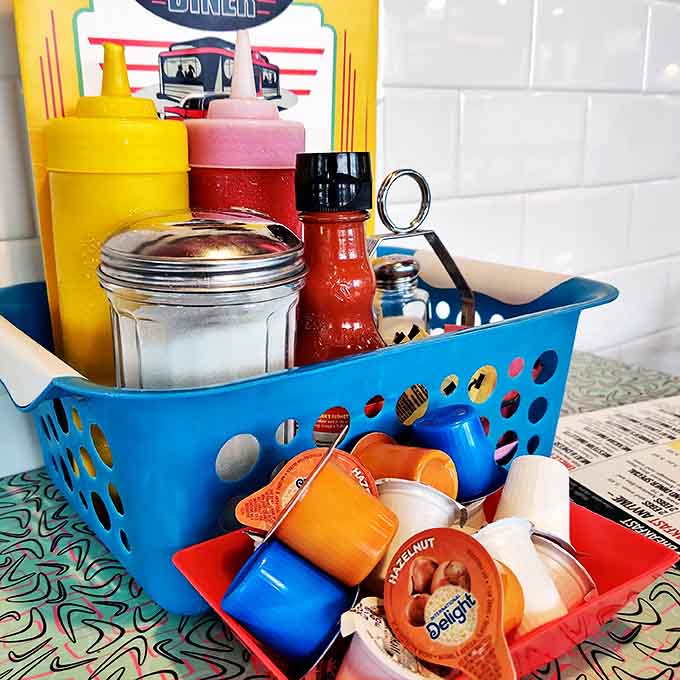 The table's treasure chest &ndash; ketchup, mustard, and those little jelly packets that somehow taste better here than anywhere else on earth.