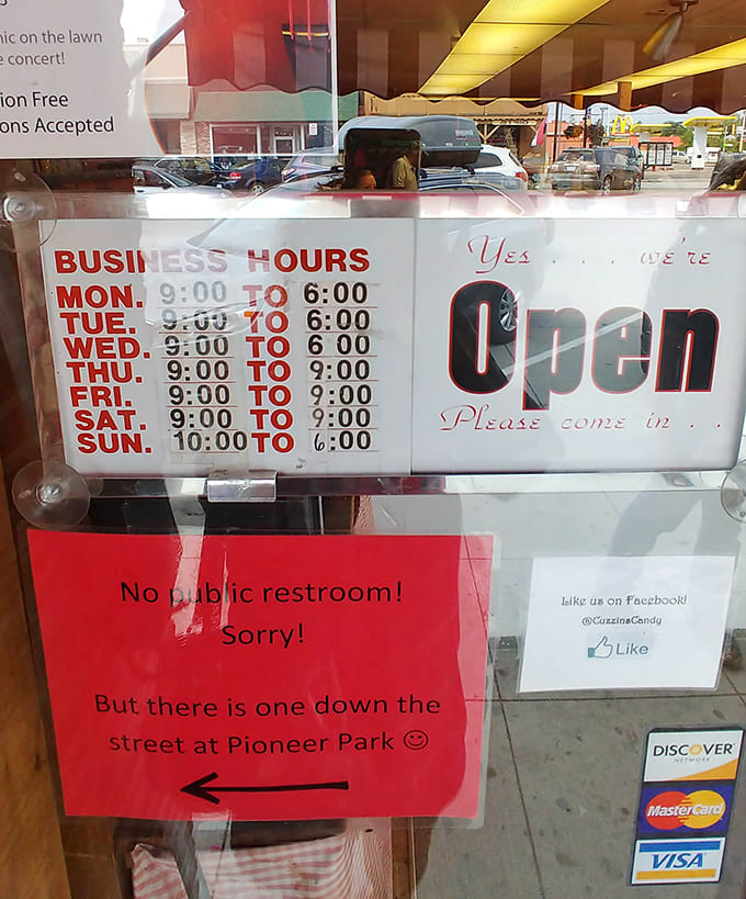 The business hours sign helpfully directs bathroom-seekers to Pioneer Park, because priorities matter when you're sugar-loaded.