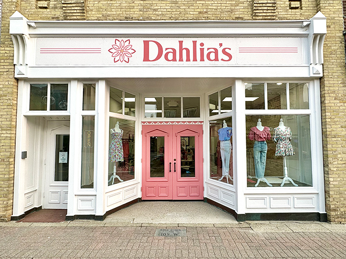 Dahlia's Downtown Boutique's pristine storefront and pink doors whisper promises of fabulous finds within.