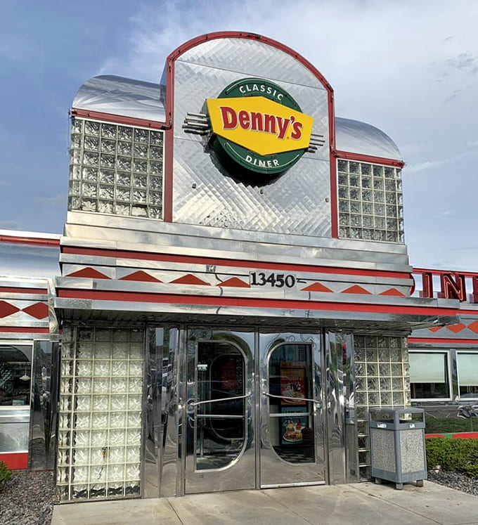 By day, the diner's exterior is all business, but at night it transforms into a neon-lit beacon for hungry travelers and night owls.